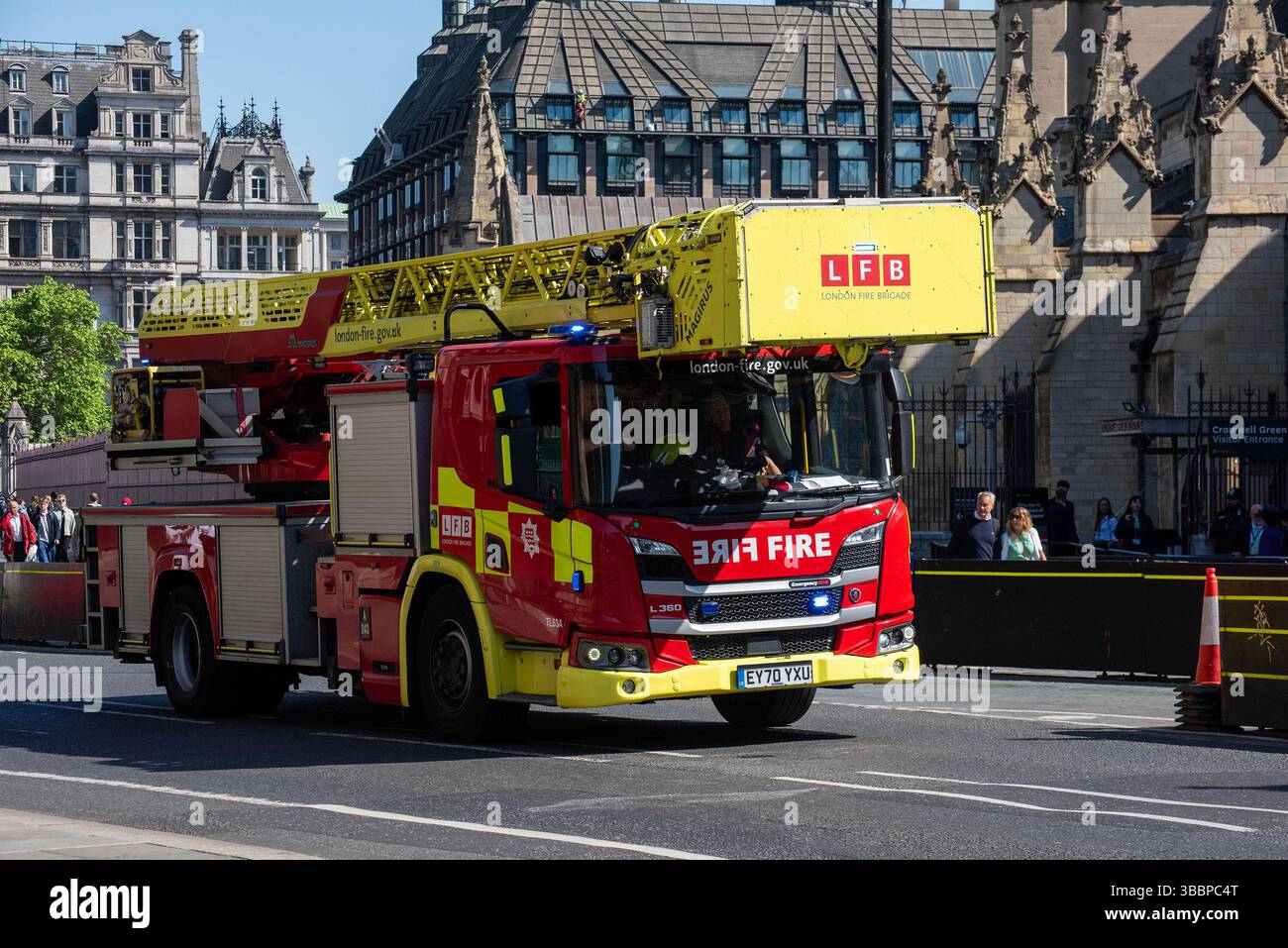 A fire truck seen using flashing lights and sirens while passing by the ...