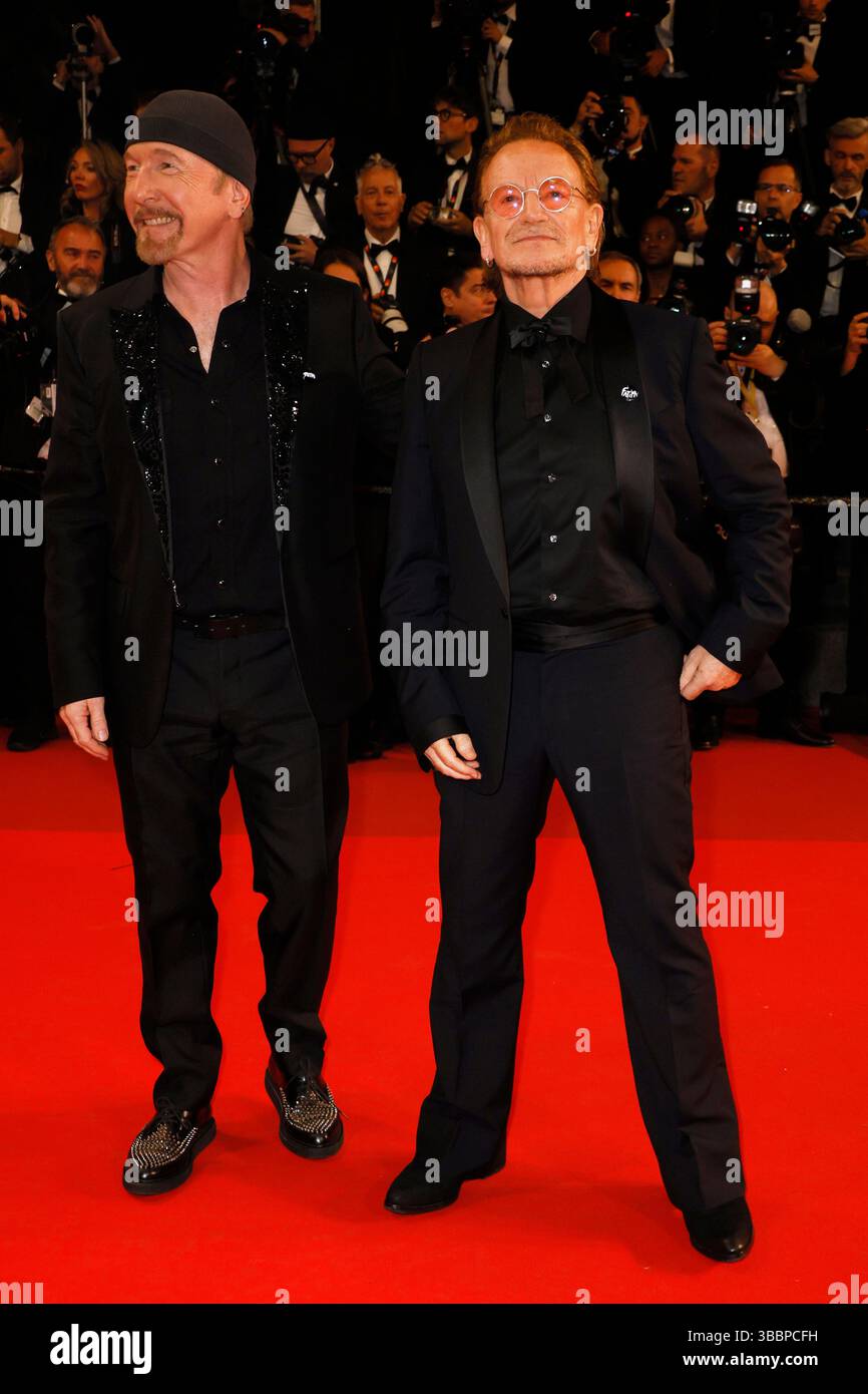 The Edge, left, and Bono pose for photographers upon arrival at the ...