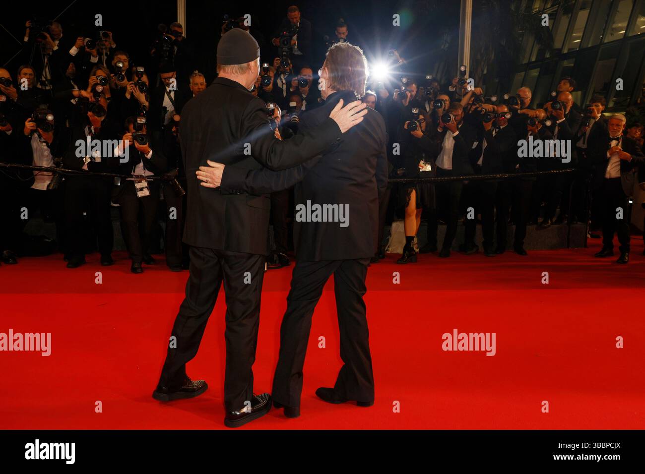 The Edge, left, and Bono pose for photographers upon arrival at the ...