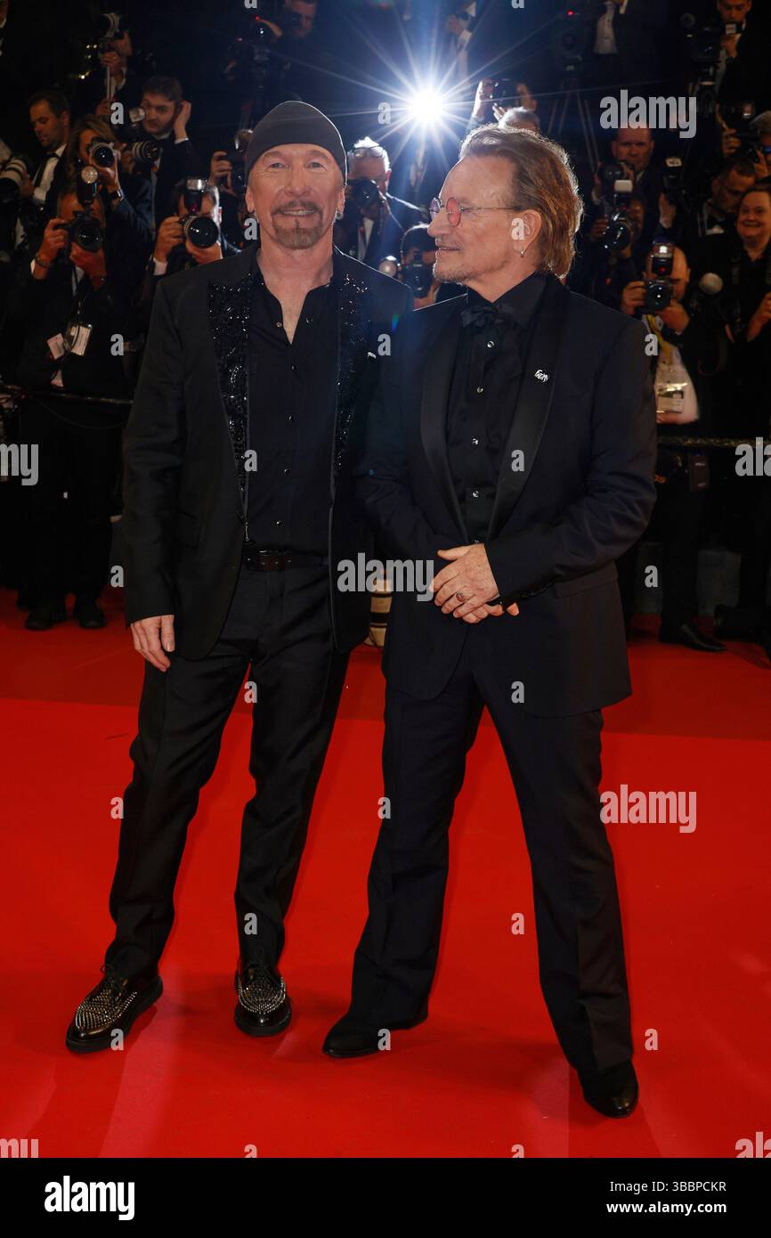 The Edge, left, and Bono pose for photographers upon arrival at the ...
