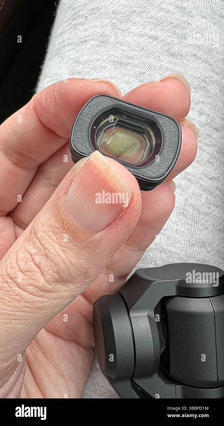 Hand Holding Small Scratched Camera Lens with Gimbal, Precision Optics ...