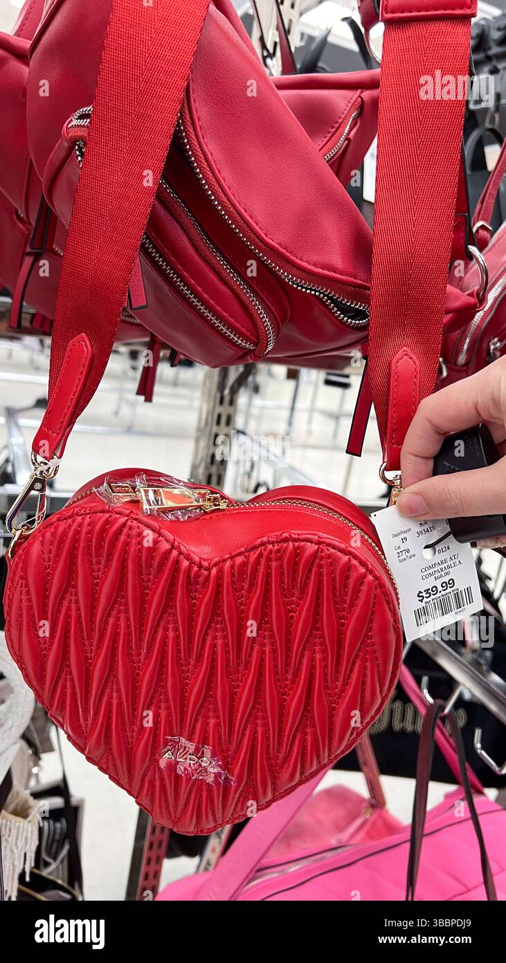Ottawa, ON Canada - May 01, 2025: Stylish red heart-shaped handbag with ...