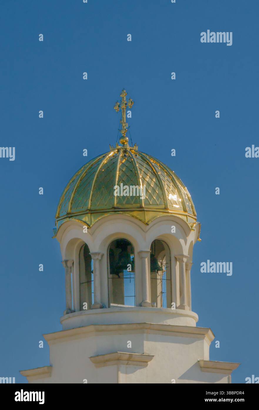 The striking golden dome of a historic church stands tall, featuring ...