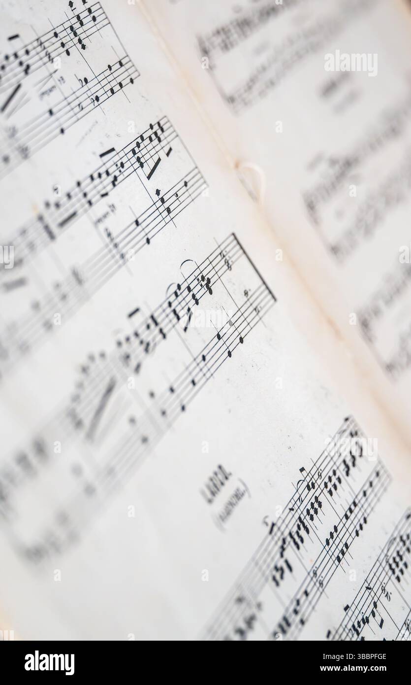 Macro close-up of aged piano sheet music revealing crisp musical ...