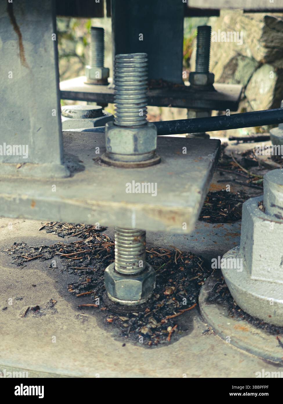 Reinforced concrete foundation with metal anchor bolts designed for the ...