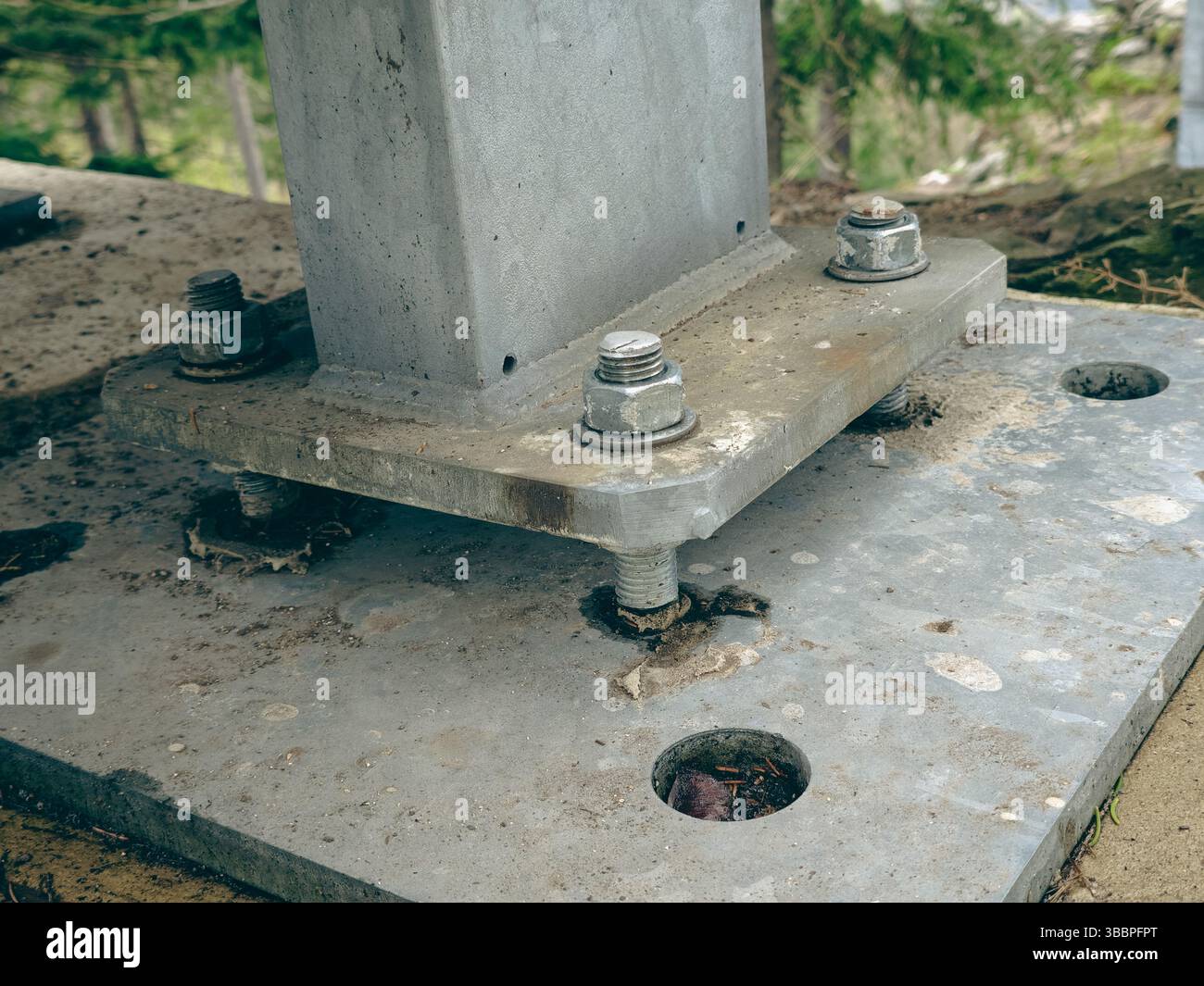 Reinforced concrete foundation with metal anchor bolts designed for the ...