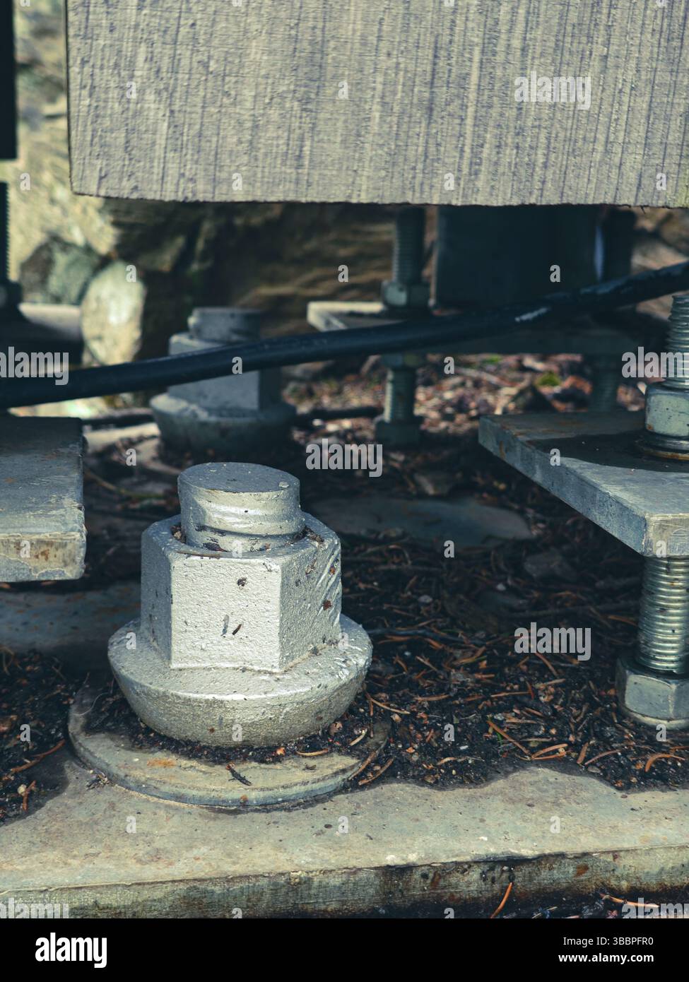 Reinforced concrete foundation with metal anchor bolts designed for the ...