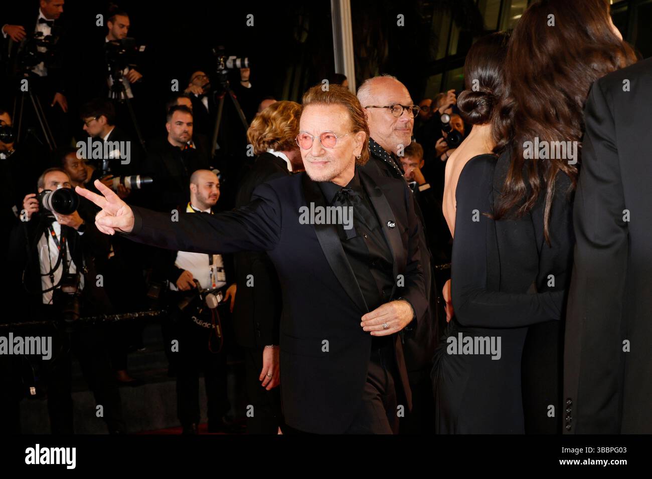 Bono poses for photographers upon arrival at the premiere of the film ...