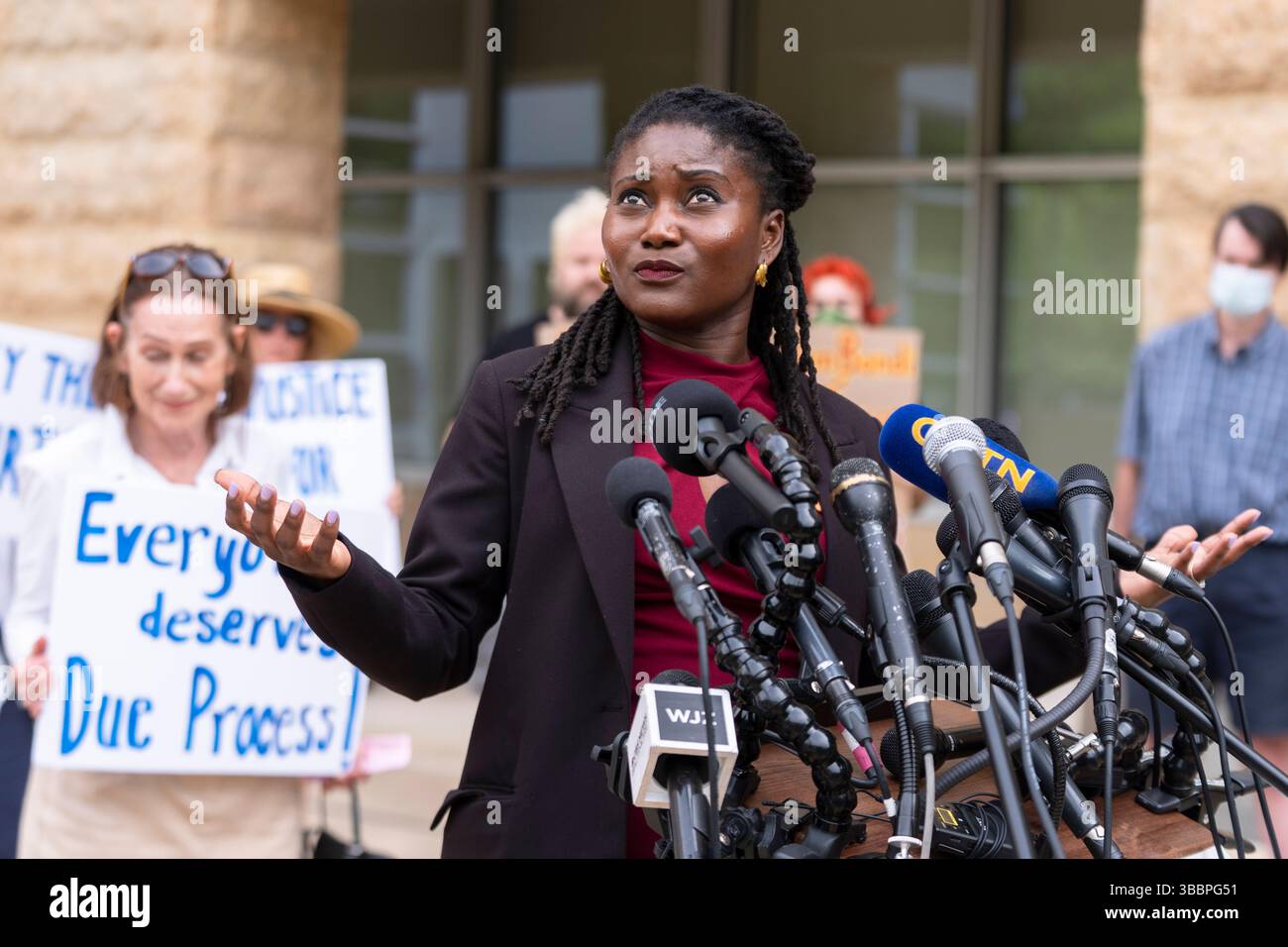 Ama Frimpong, Legal Director at CASA, gives an update of an ongoing hearing at a Federal ...