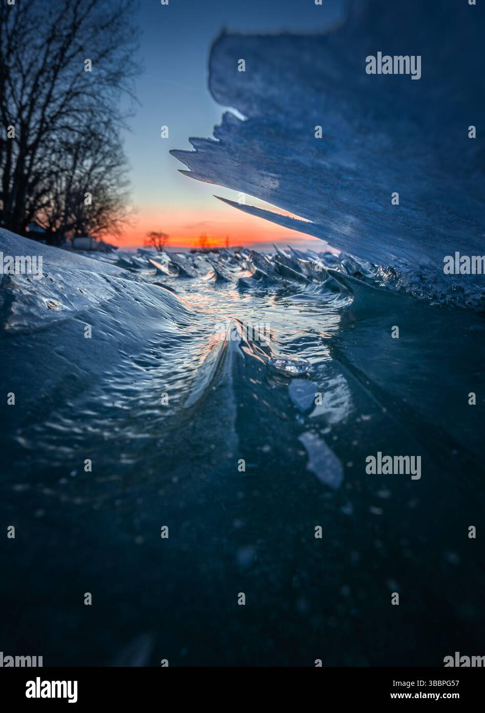 Fonyod, Hungary - Frozen Lake Balaton at sunset with colorful golden ...