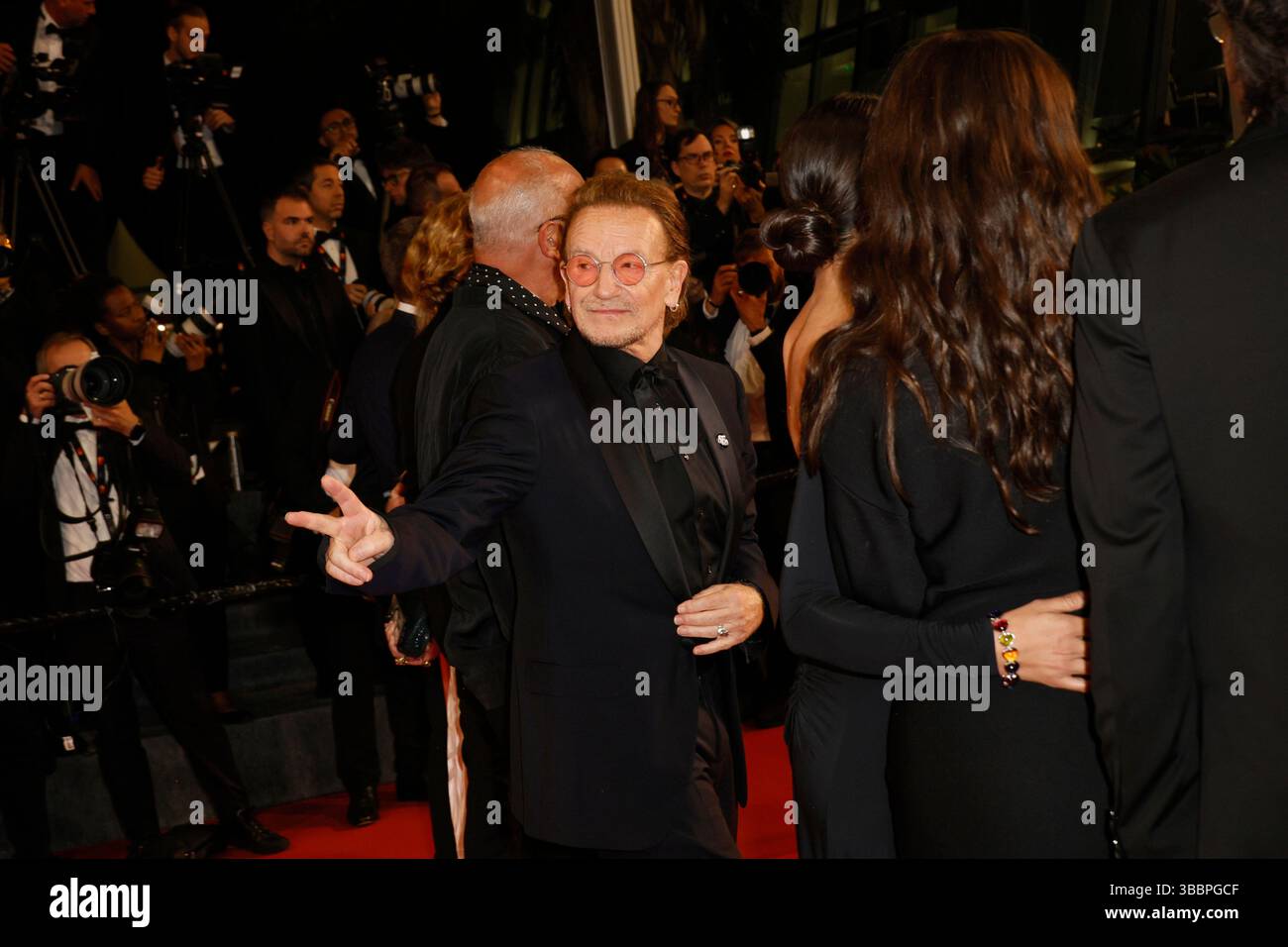 Bono poses for photographers upon arrival at the premiere of the film ...