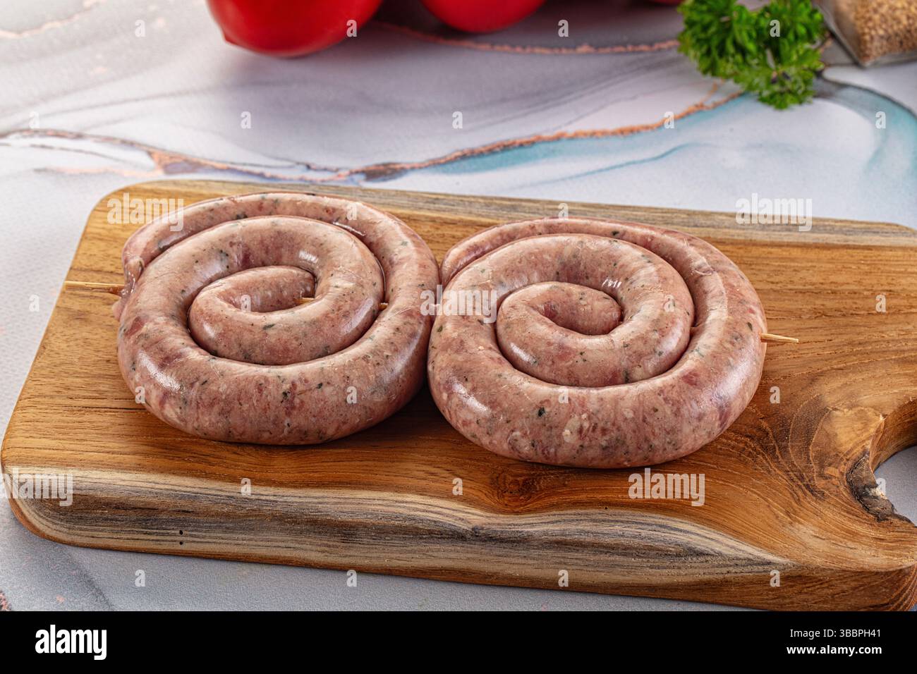Raw meat pork and beef swirl sausages for grill Stock Photo - Alamy
