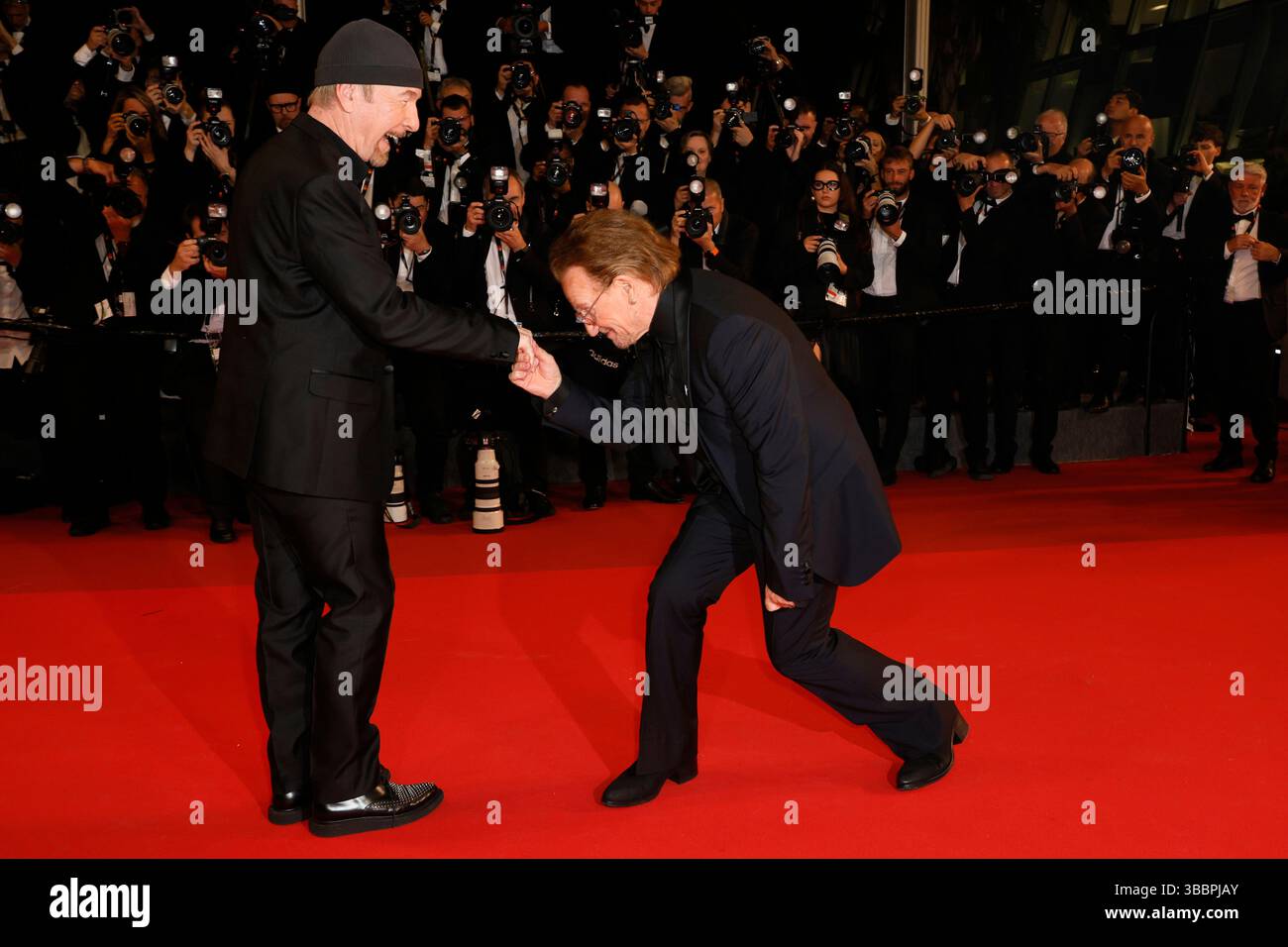 The Edge, left, and Bono pose for photographers upon arrival at the ...