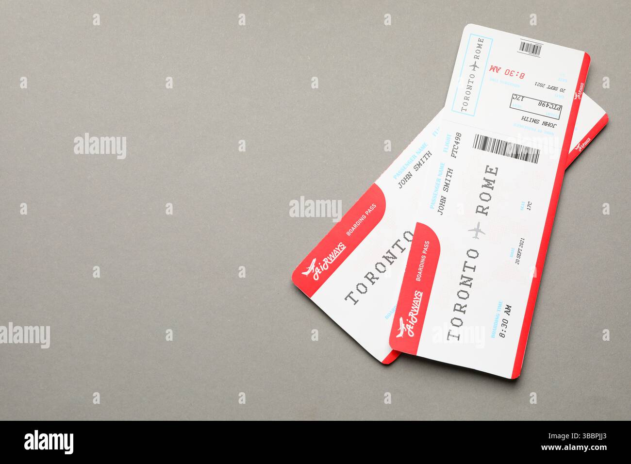 Travel agency. Flight tickets on grey background, top view. Space for ...
