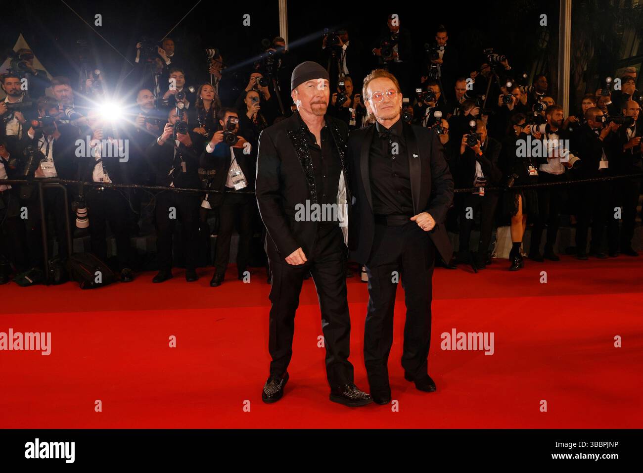 The Edge, left, and Bono pose for photographers upon arrival at the ...