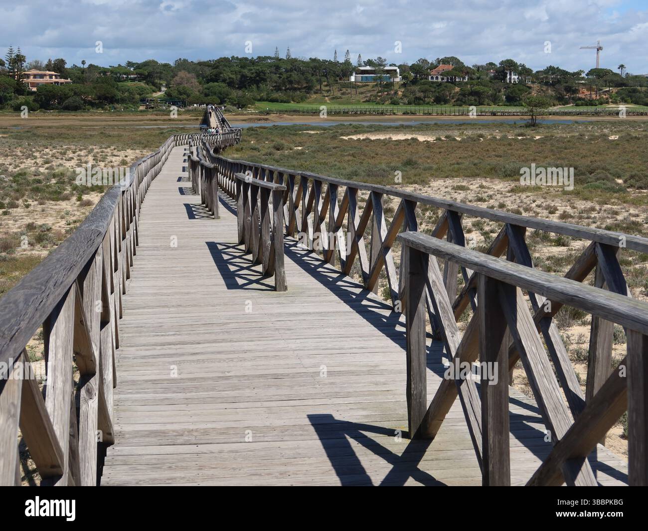 Spanning the Ria Formosa, a tidal lagoon, the Quinta do Lago bridge ...