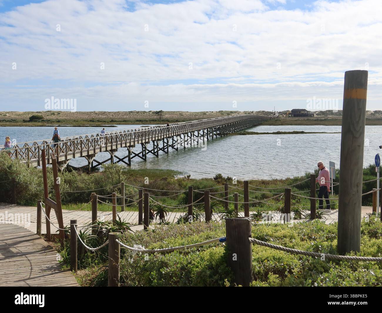 Spanning the Ria Formosa, a tidal lagoon, the Quinta do Lago bridge ...