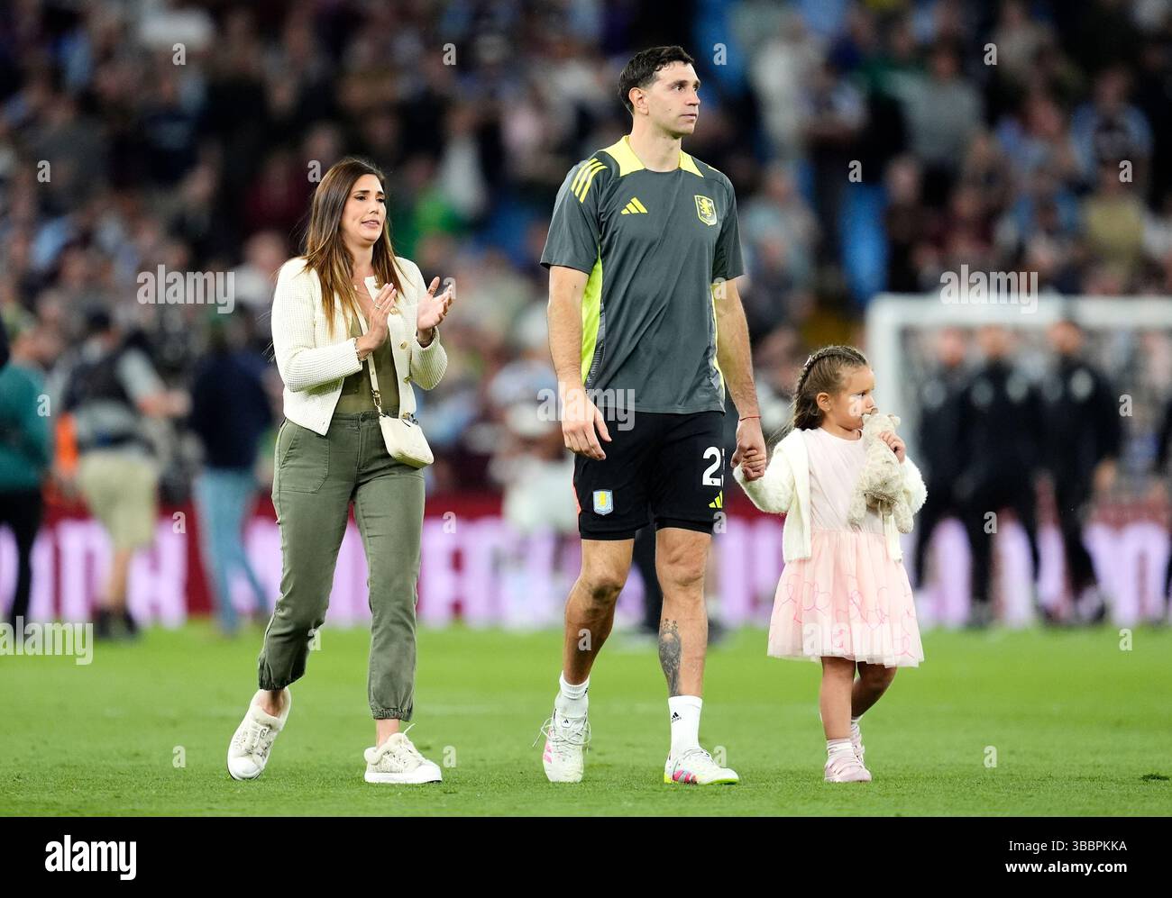Aston Villa goalkeeper Emiliano Martinez (centre) with his wife Amanda ...