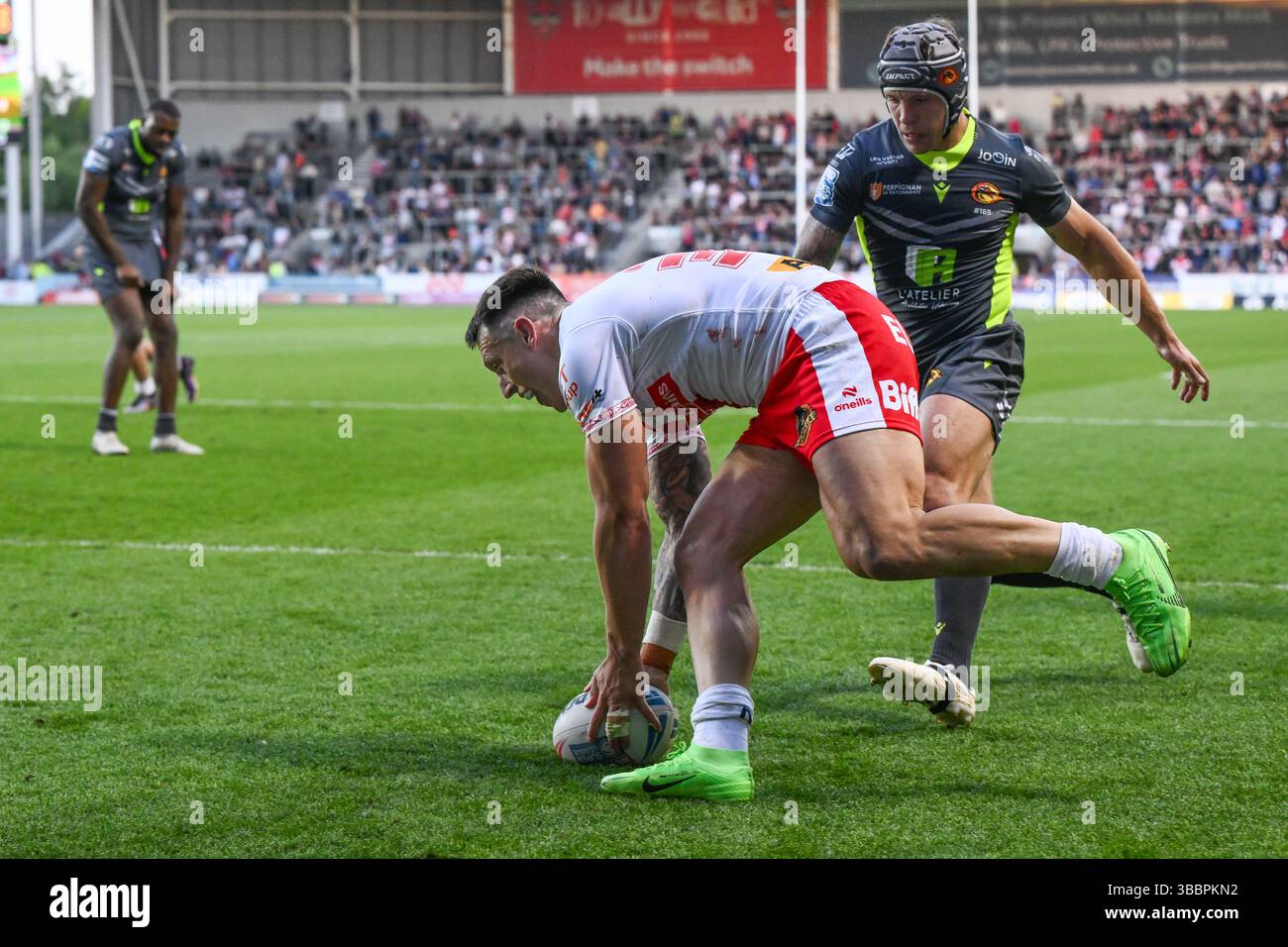 ST. HELENS, ENGLAND - 15 MAY 2025: Deon Cross of St. Helens goes over ...