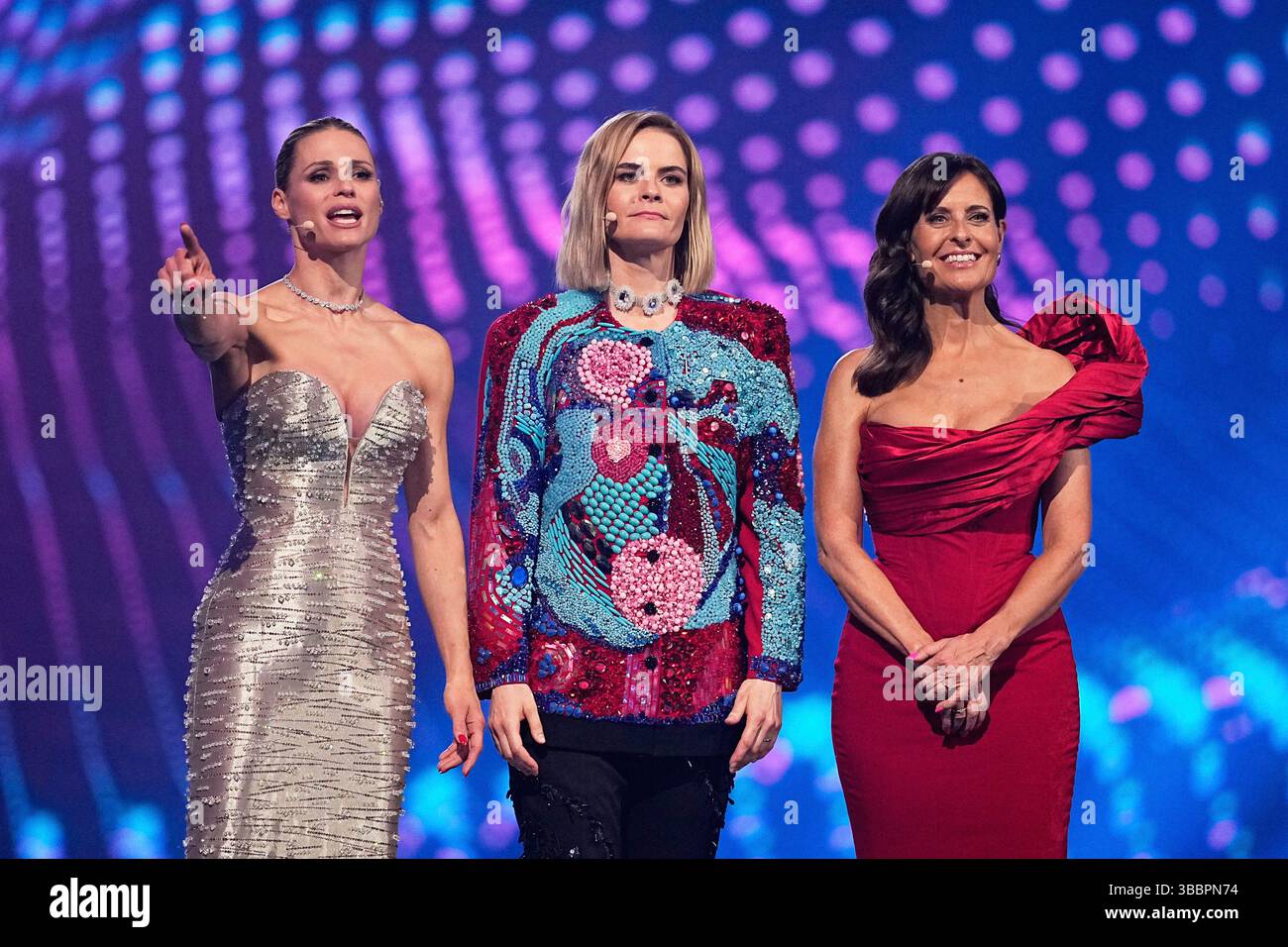 Hosts Michelle Hunziker, left, Sandra Studer and Hazel Brugger, onstage ...