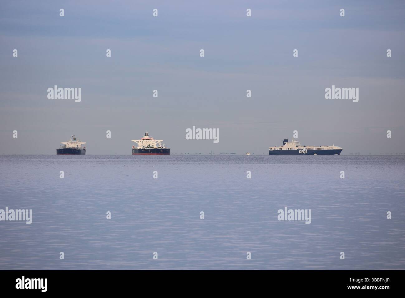 Three large ships are sailing in the ocean Stock Photo - Alamy