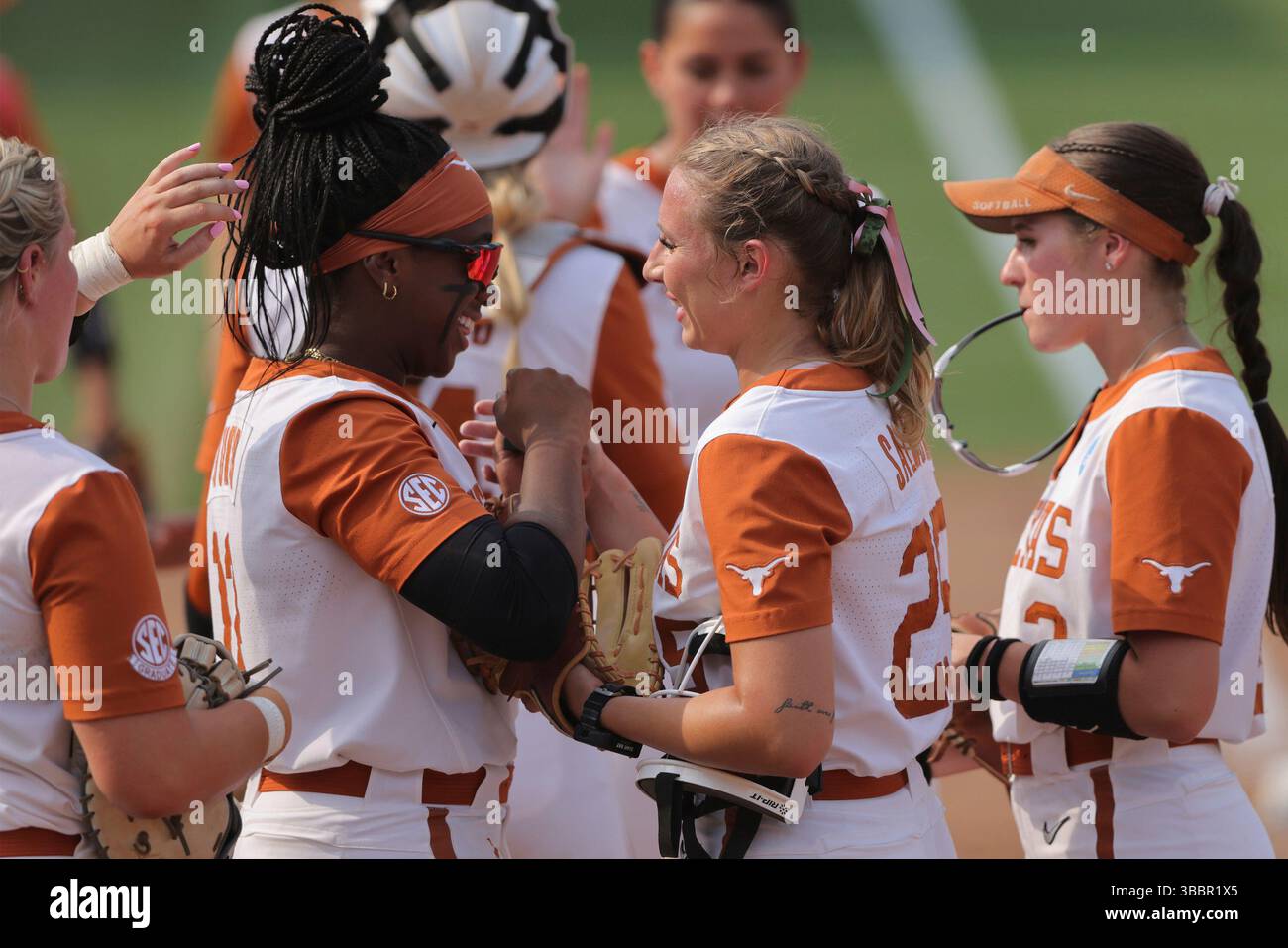 Texas infielder Victoria Hunter, left, celebrates an out against ...