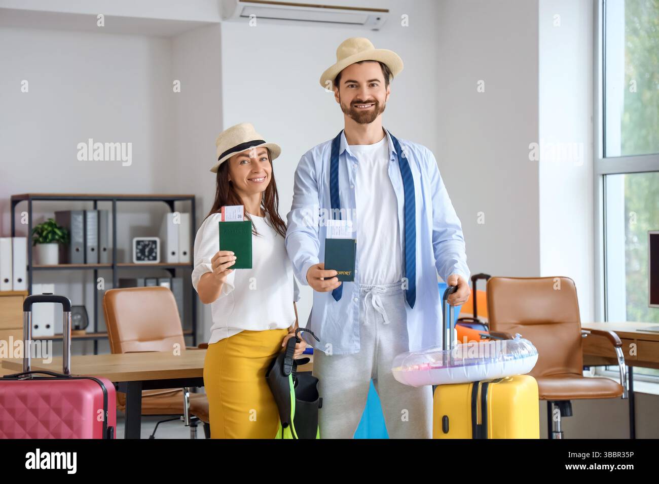 Business colleagues with passports waiting for summer vacation in ...