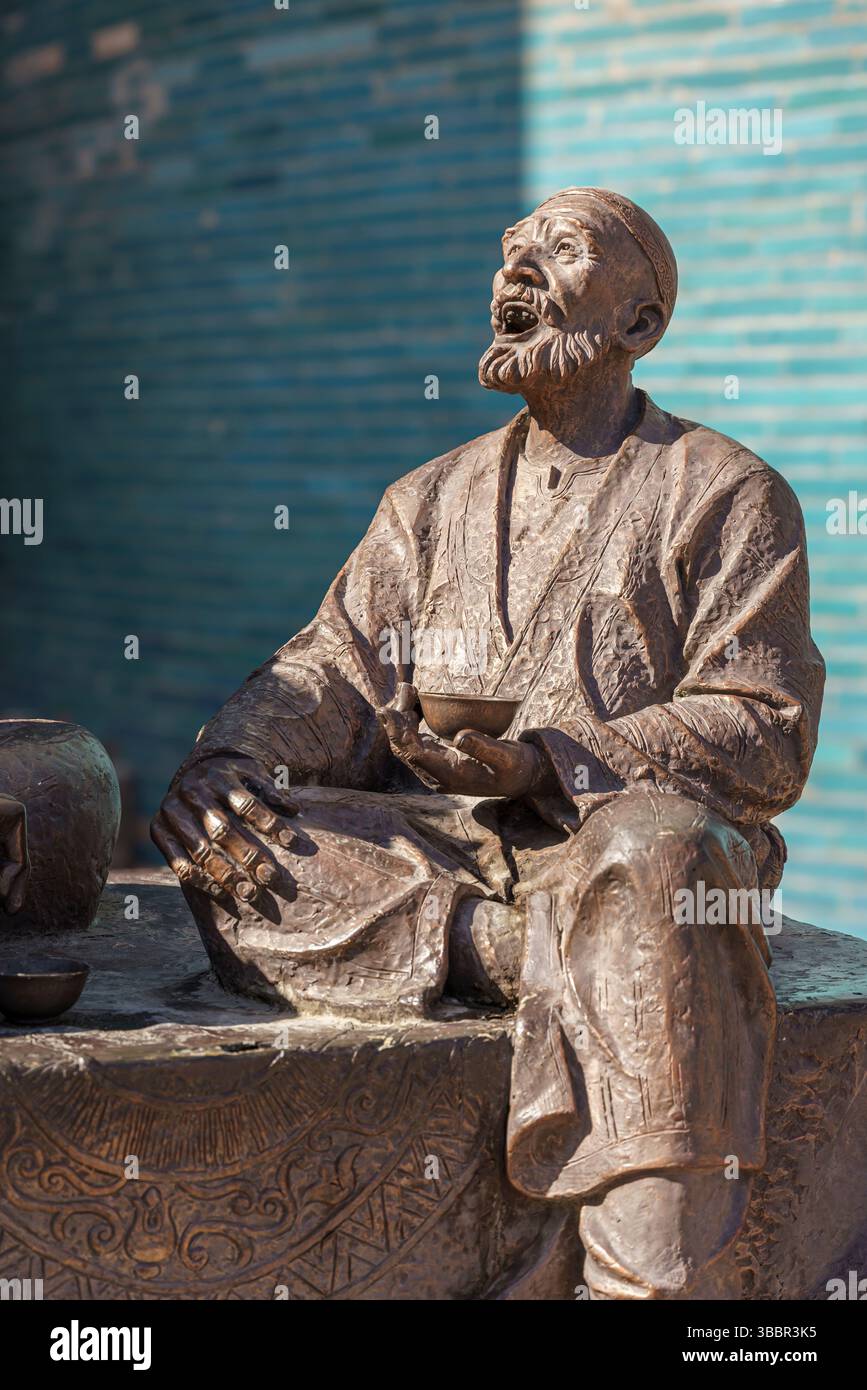 A bronze statue of two old friends sits on a bench in Khiva Uzbekistan ...