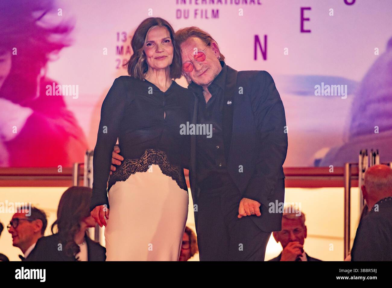 Bono and Ali Hewson pose for photographers upon departing the premiere ...