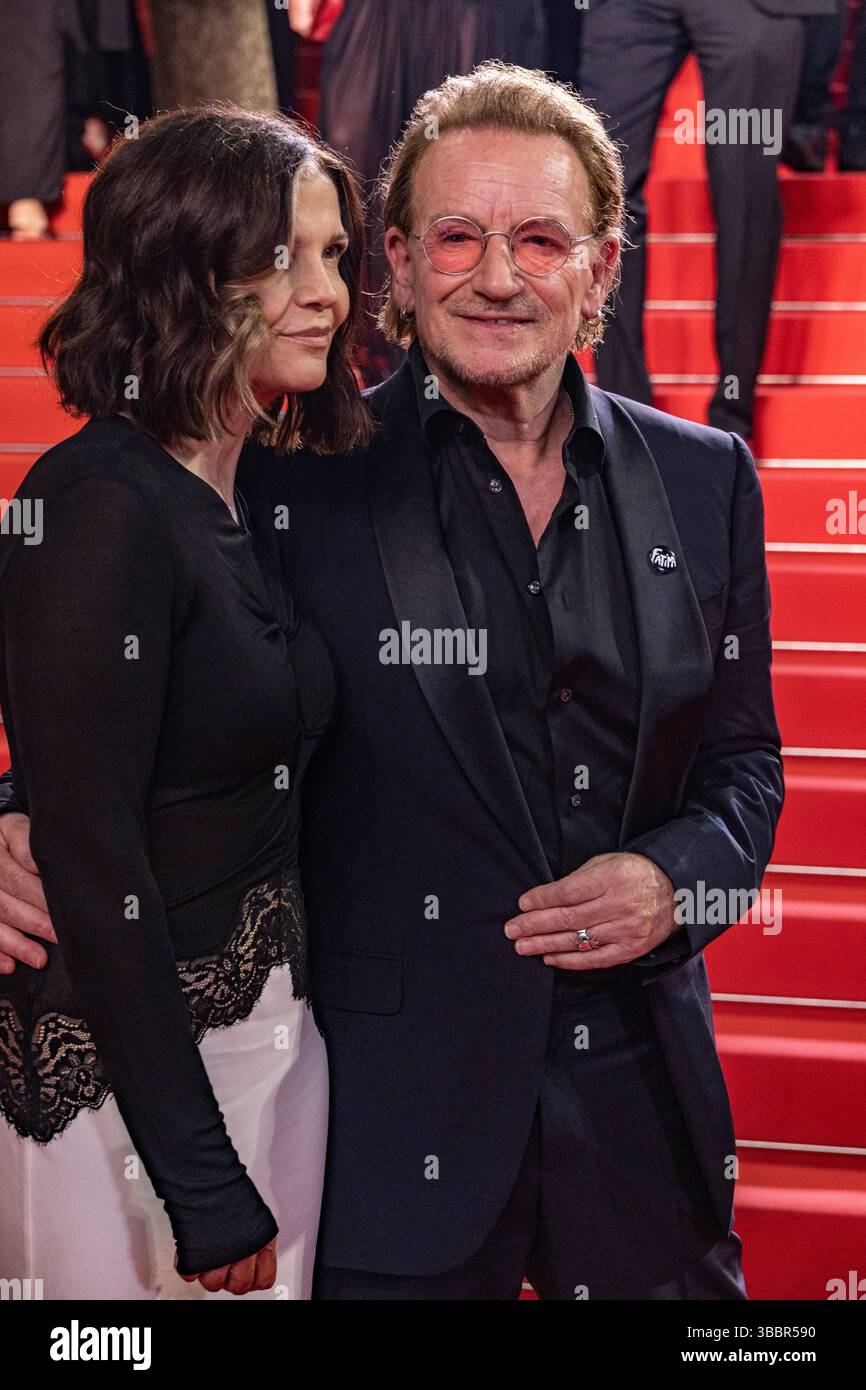 Bono and Ali Hewson pose for photographers upon departing the premiere ...