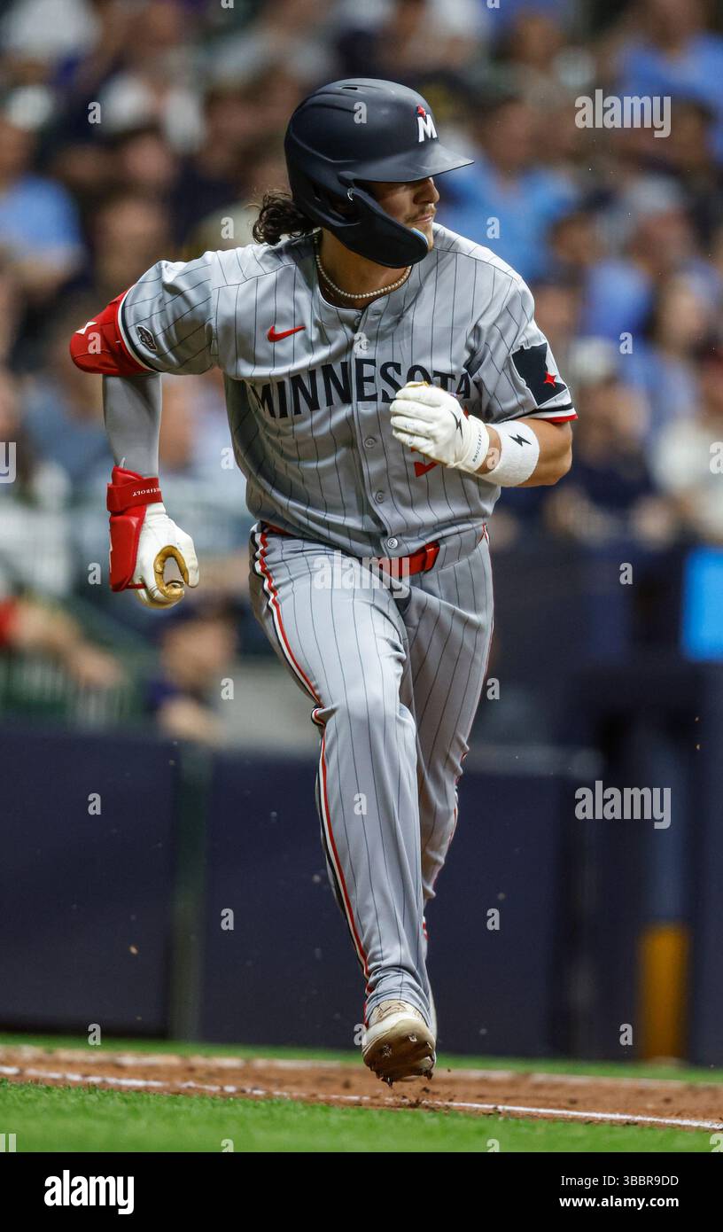 Minnesota Twins' Ryan Fitzgerald runs after hitting a flyout during the ...