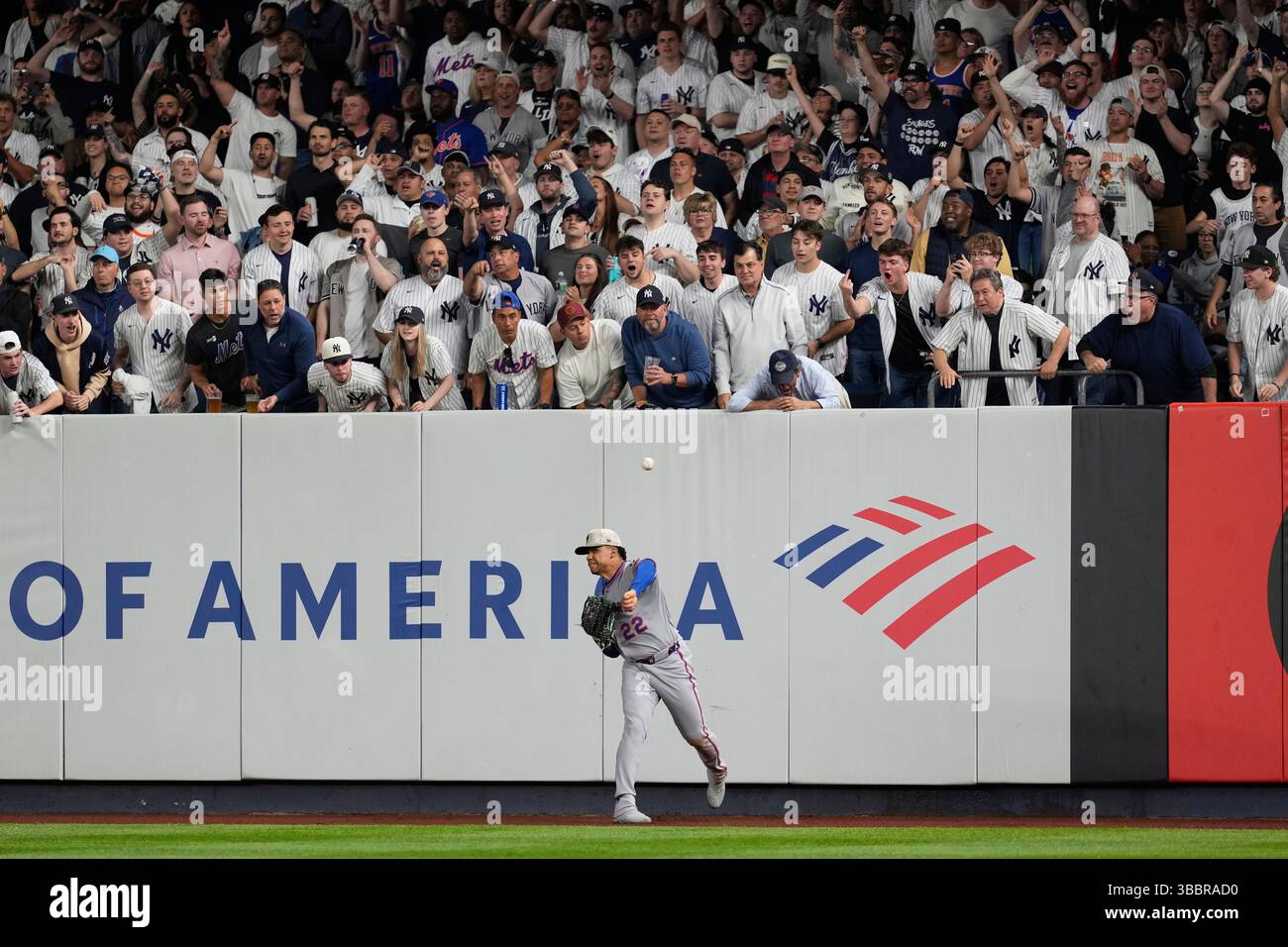 Fans watch as New York Mets outfielder Juan Soto plays a ball off the ...