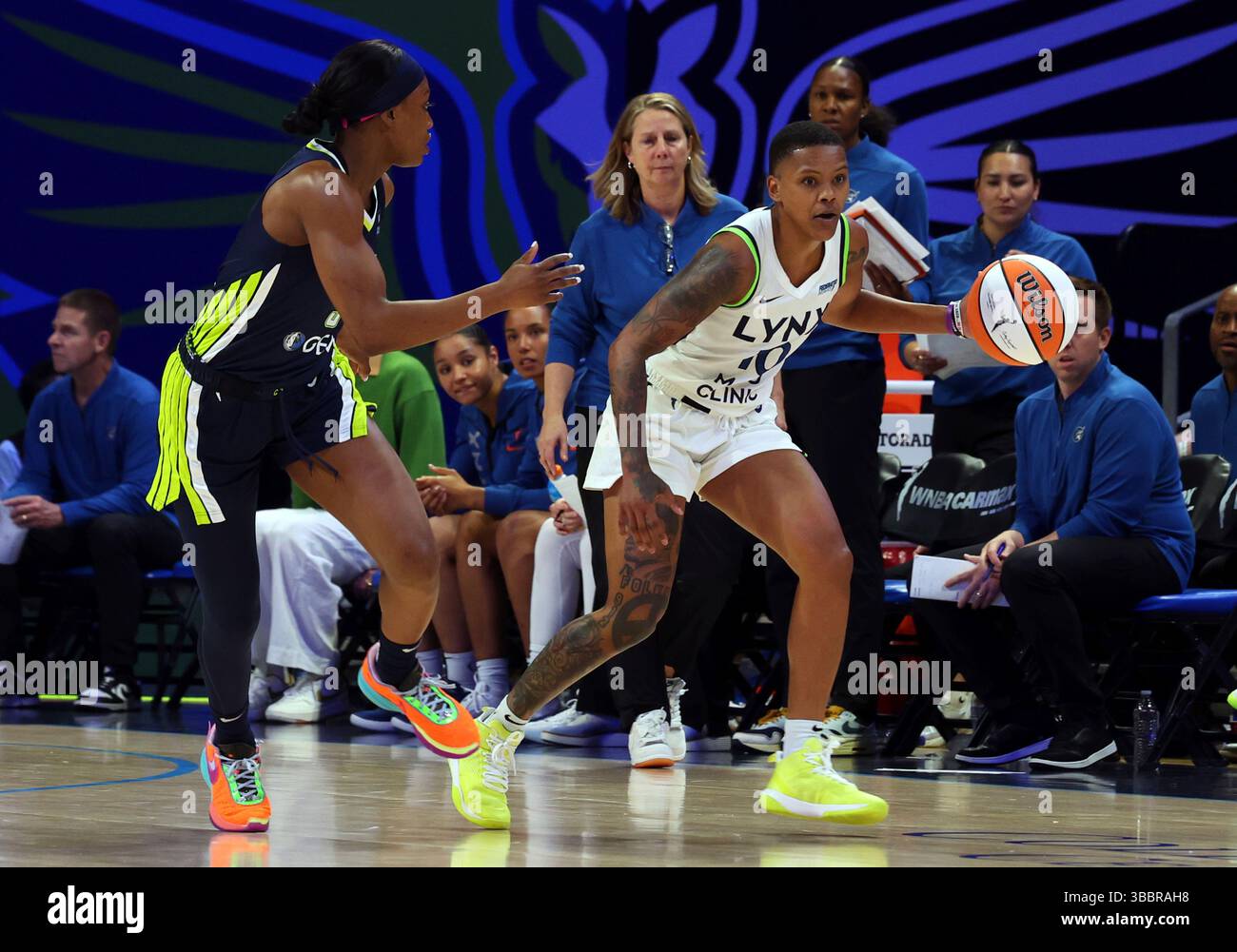 Dallas Wings guard Kaila Charles, left, guards Minnesota Lynx guard ...