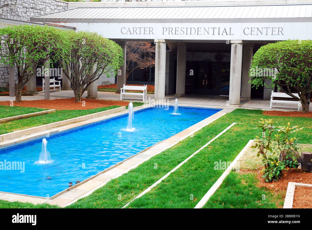 A small reflective pool stands in front of the Jimmy Carter ...