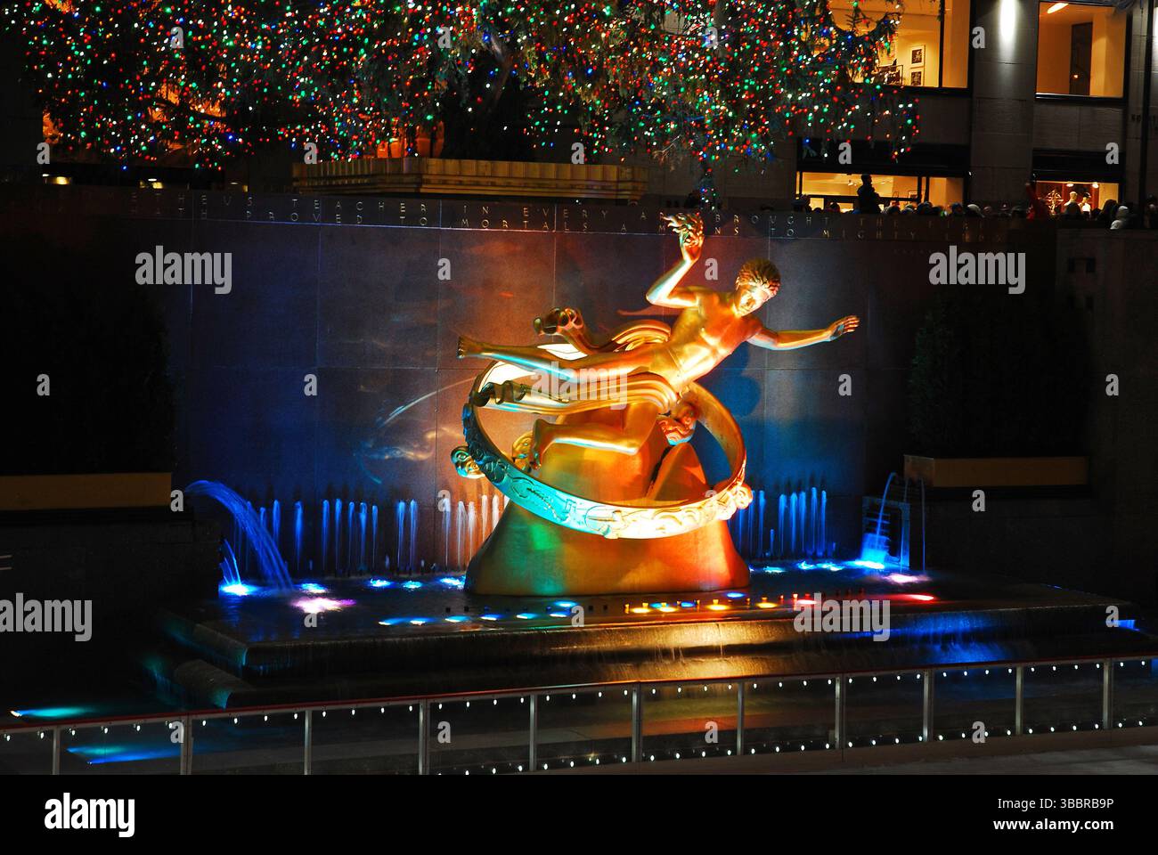 The statue of Prometheus seems to float under the famed Christmas tree ...
