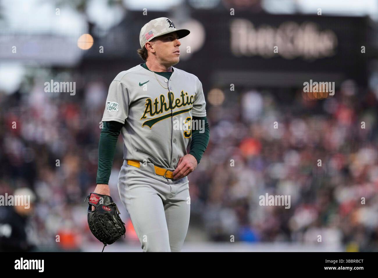 Athletics' JP Sears walks to the dugout after pitching in the second ...