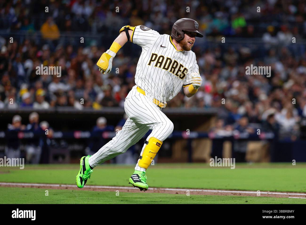 San Diego Padres' Jake Cronenworth runs up the line on a triple during ...