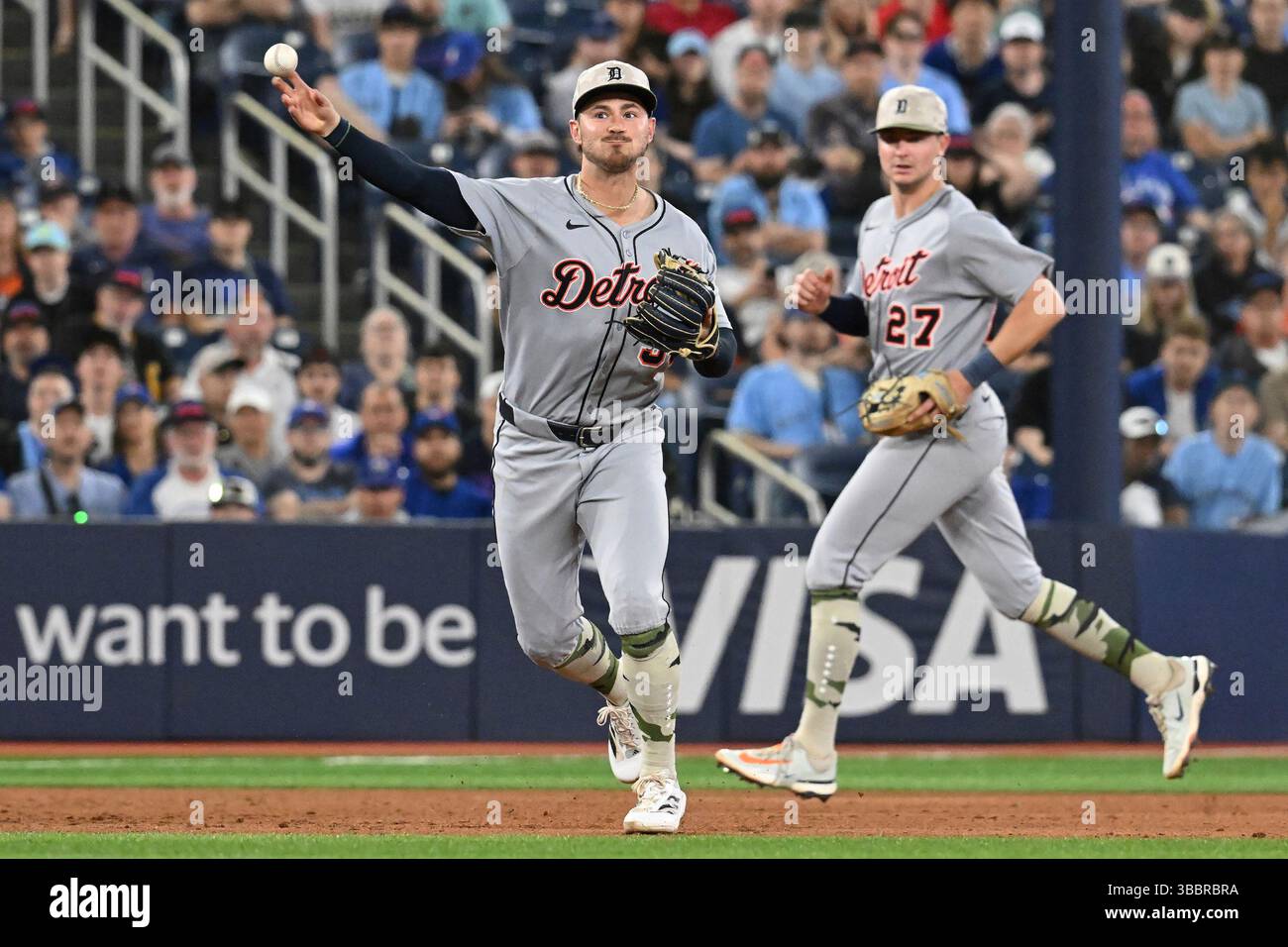 Detroit Tigers' Zach McKinstry (39) throws to first base to put out ...