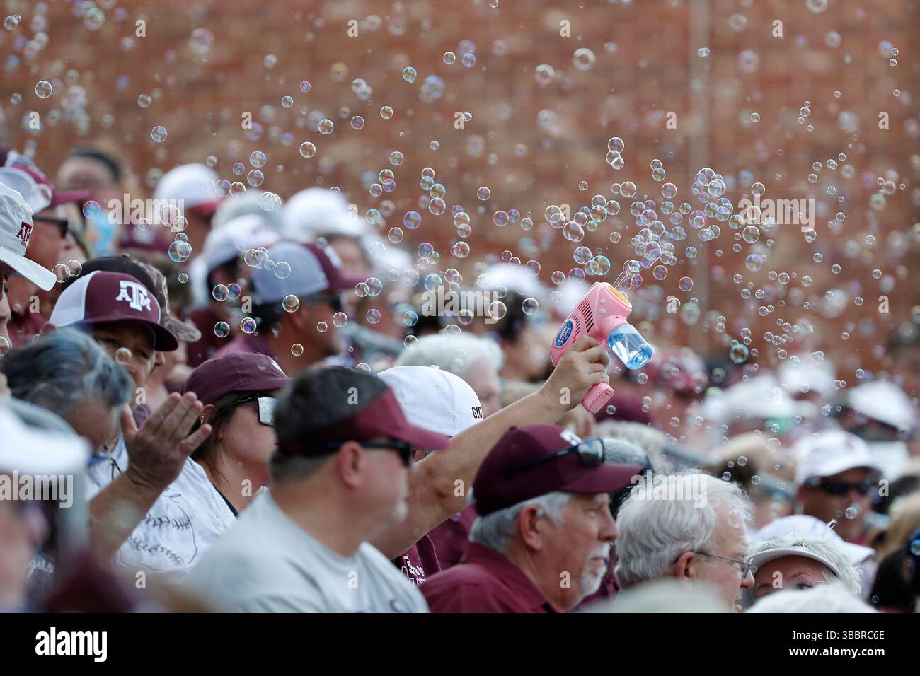Texas A&M fans fill the air with bubbles after an Aggie run is scored ...