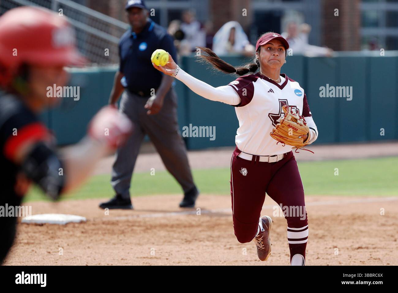 Texas A&M third baseman Larisa Perez, right, makes the play to first ...
