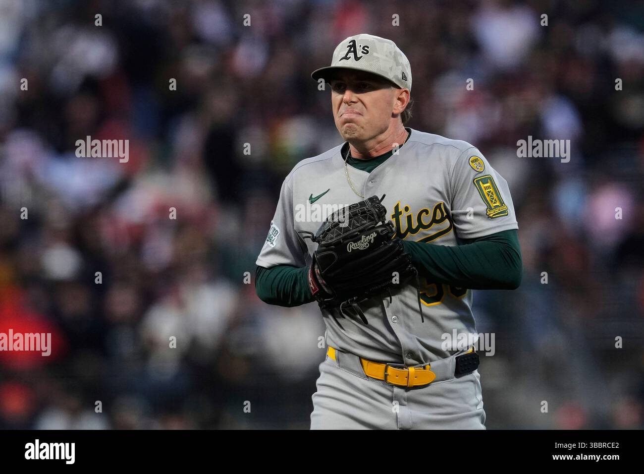 Athletics pitcher JP Sears reacts after walking San Francisco Giants ...