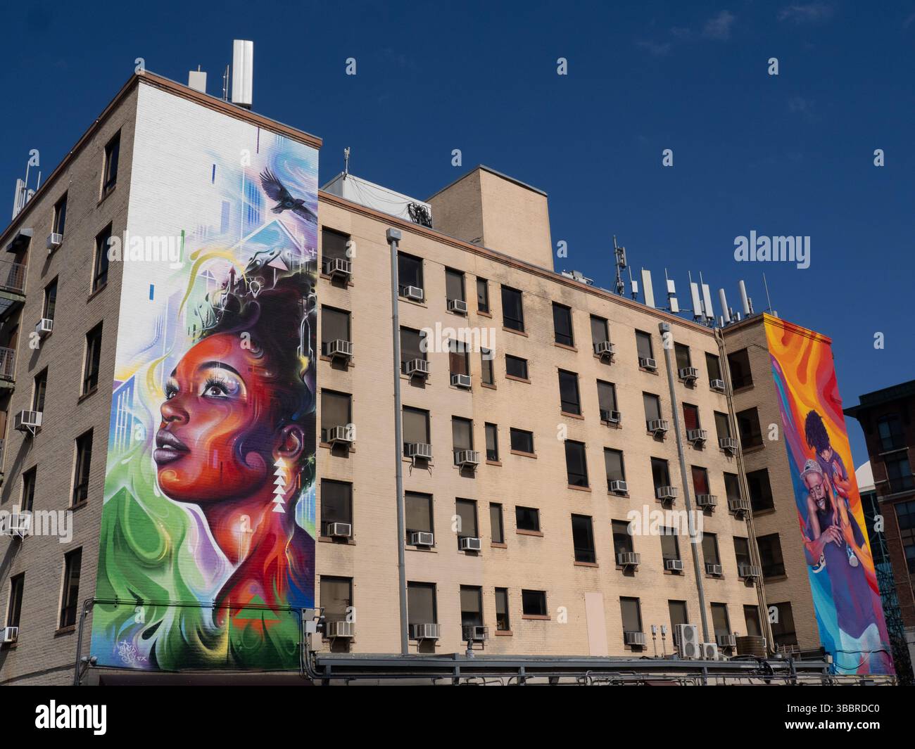 Colorful murals entitled 'Elevation' and 'Child Friendly World' on an ...
