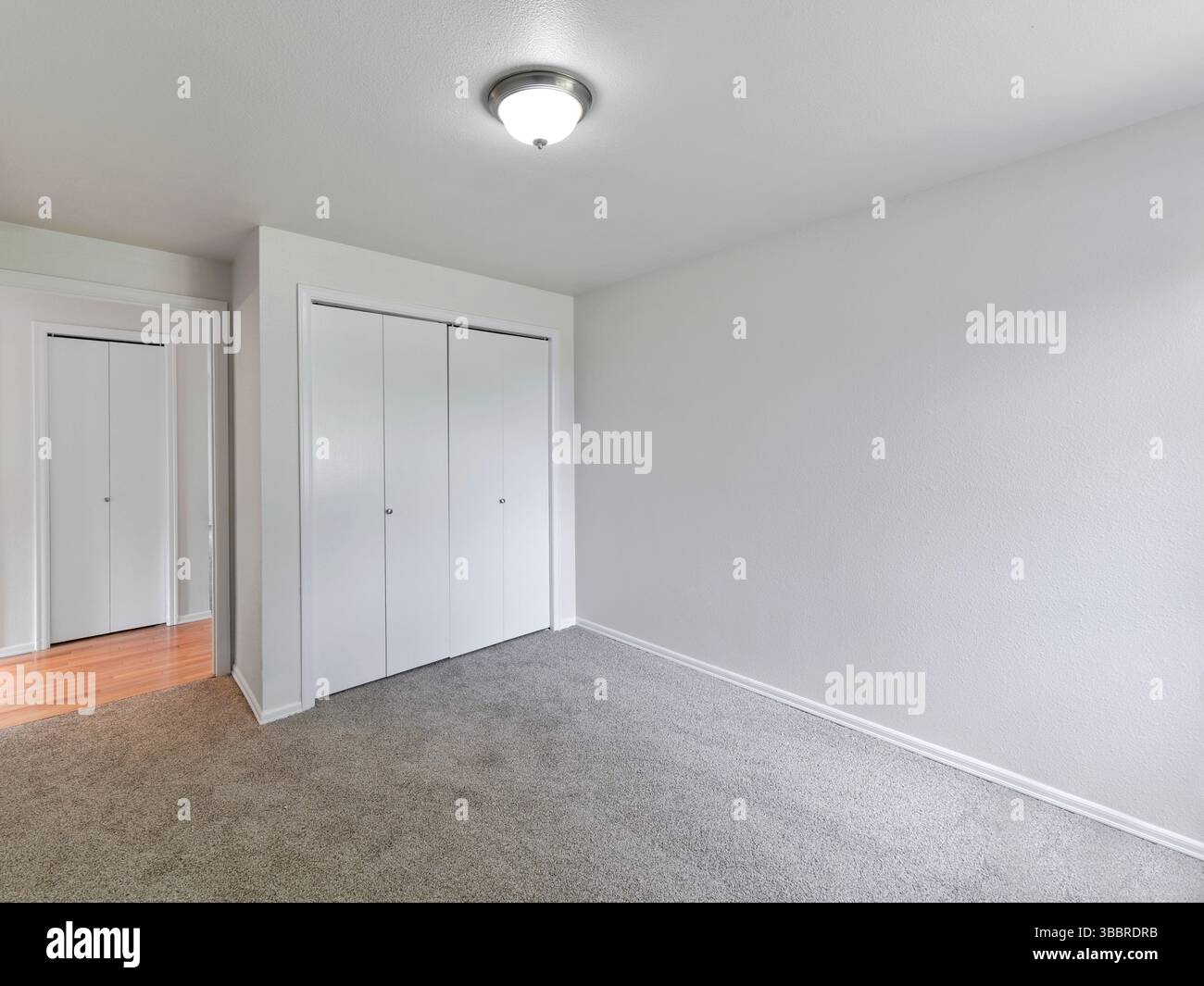 Modern residential empty bedroom interior Stock Photo - Alamy