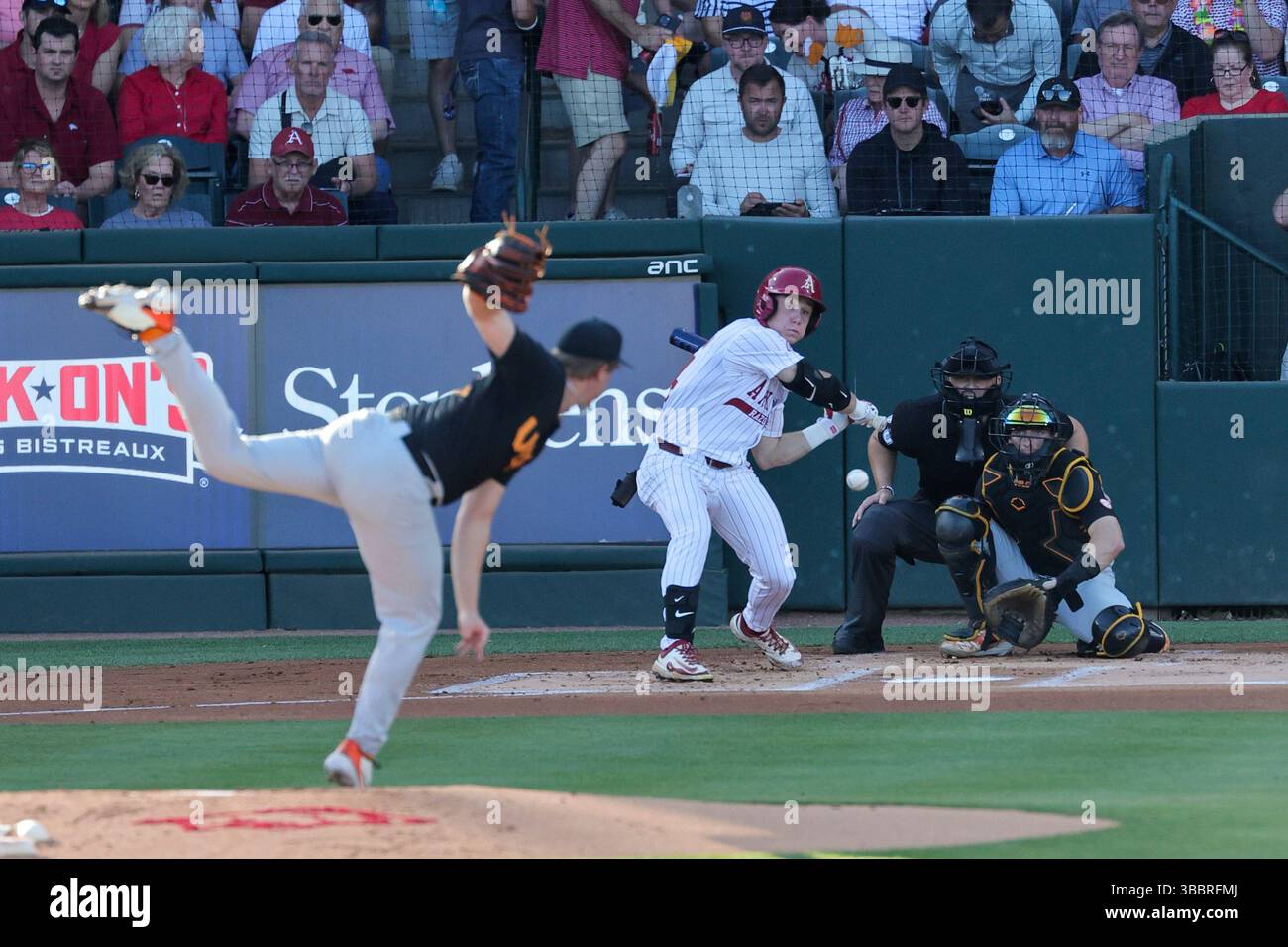 May16, 2025: Charles Davalan (24) of Arkansas looks to put a ball in ...