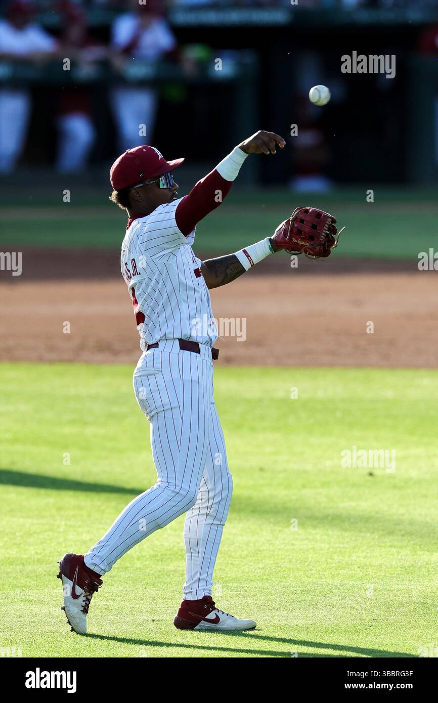 May16, 2025: Arkansas outfielder Justin Thomas Jr. (4) flips a ball ...