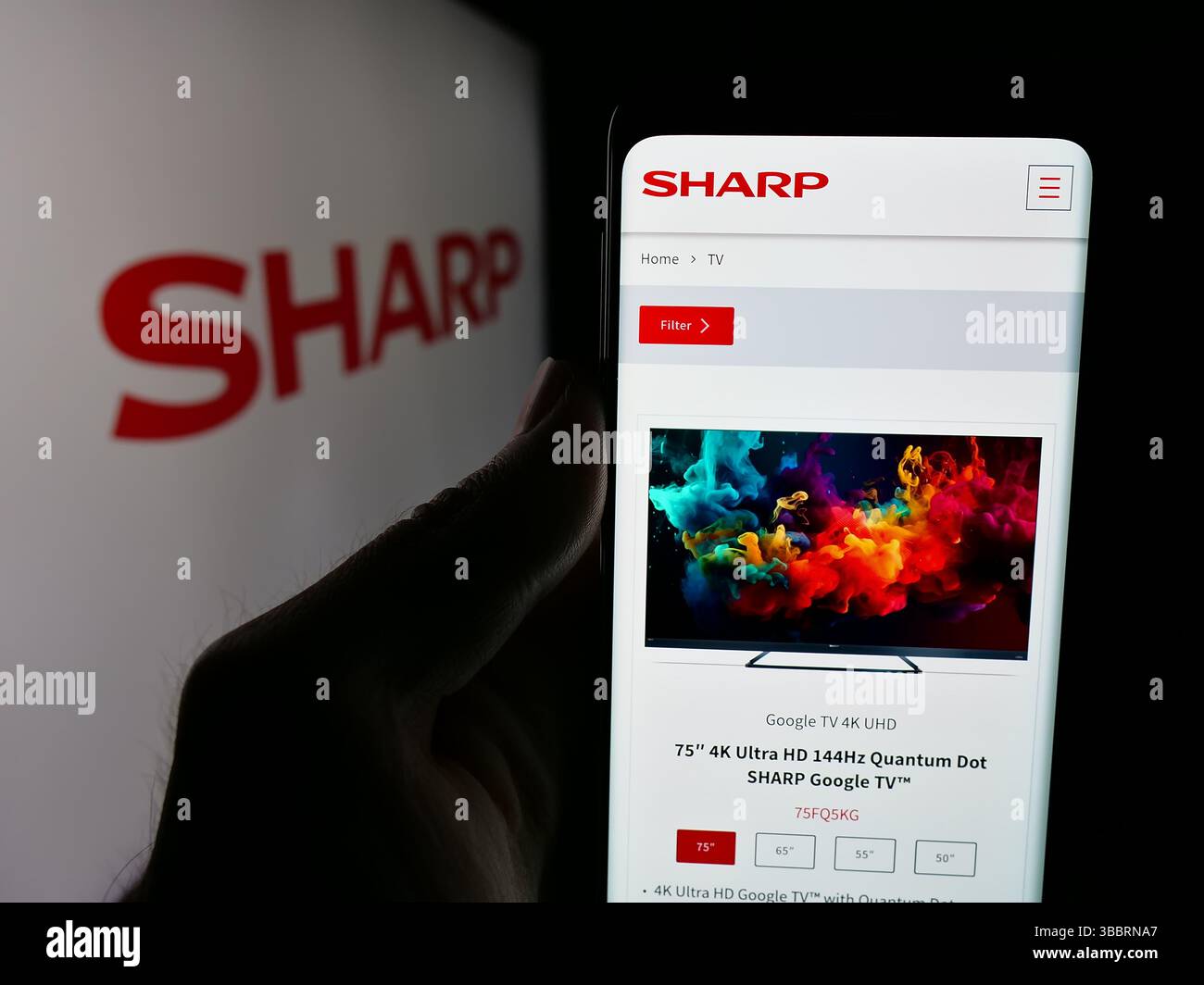 In this photo illustration, a person is holding a smartphone with the ...