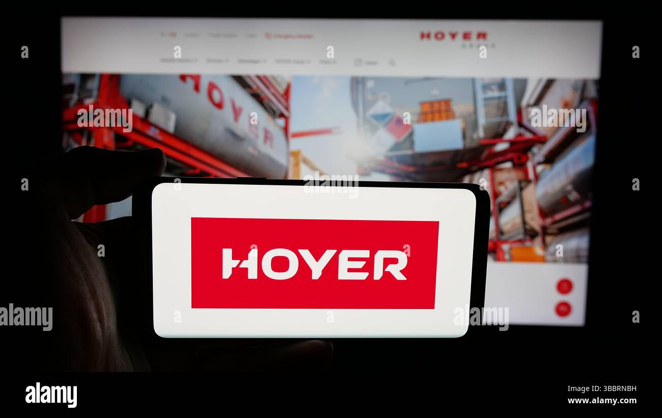 In this photo illustration, a person is holding a cellphone with the ...