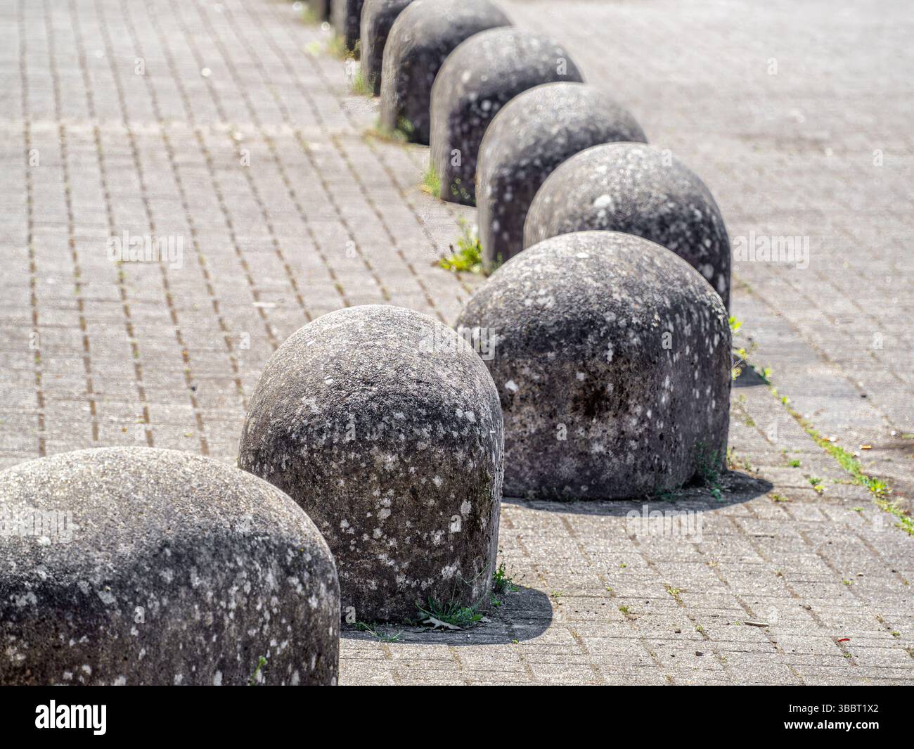 Rounded stone bollards hi-res stock photography and images - Alamy