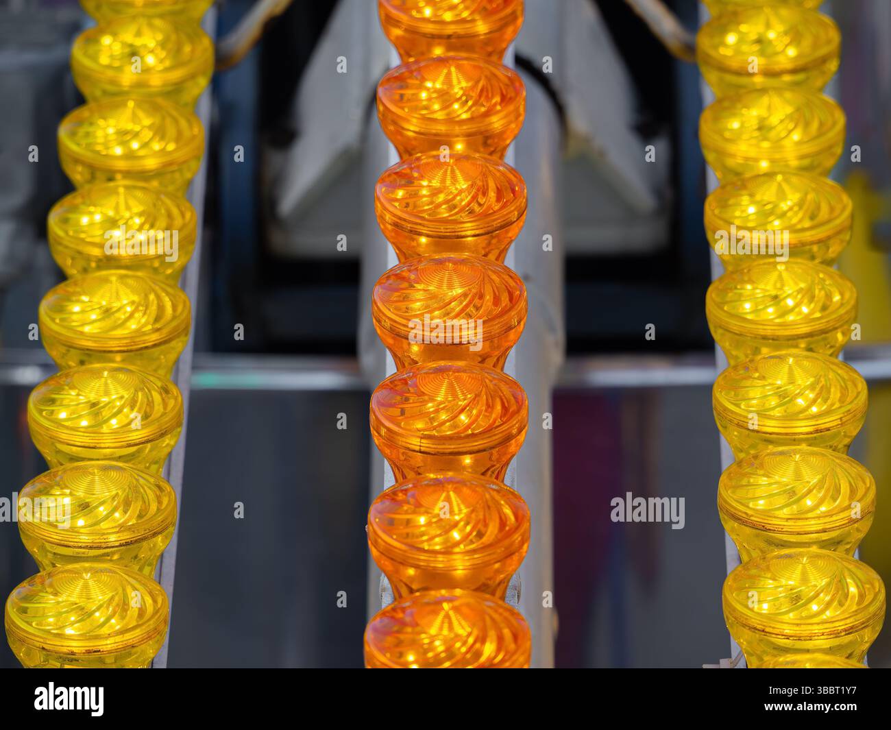 A close-up view of colorful, shiny, dome-shaped objects arranged in a ...