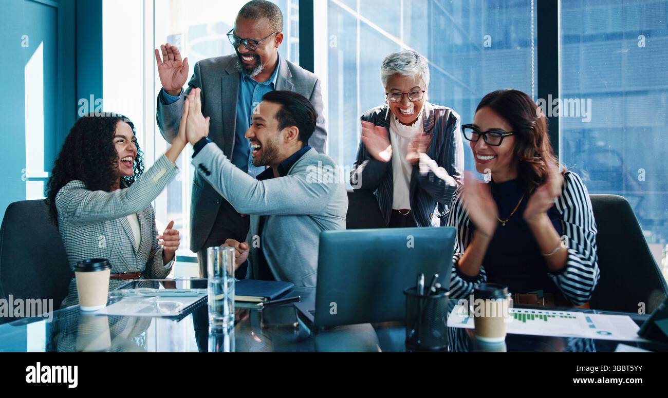 Applause, high five and success with business people in boardroom of office together for ...